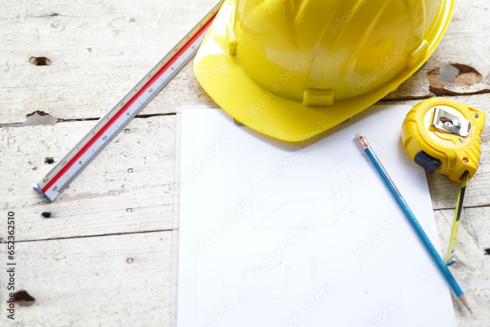 Set of professional construction tools and safety helmet on a work ...