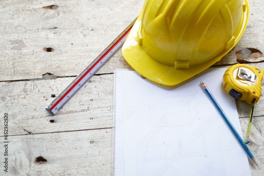 Set of professional construction tools and safety helmet on a work ...