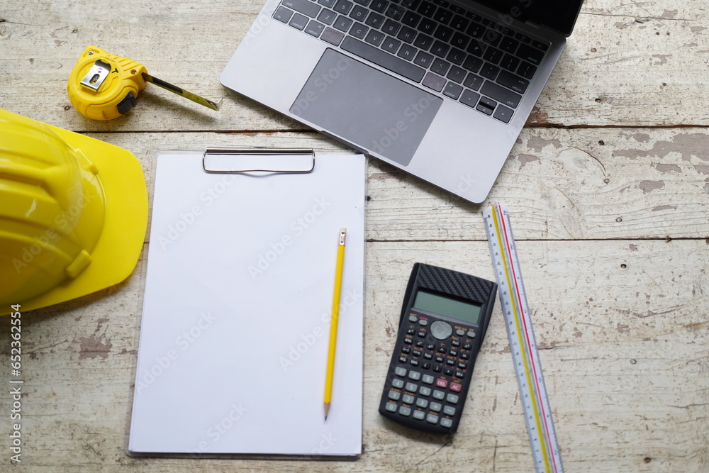 Set of professional construction tools and safety helmet on a work ...