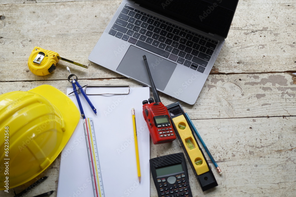 Set of professional construction tools and safety helmet on a work ...