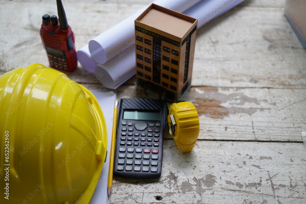 Set of professional construction tools and safety helmet on a work ...