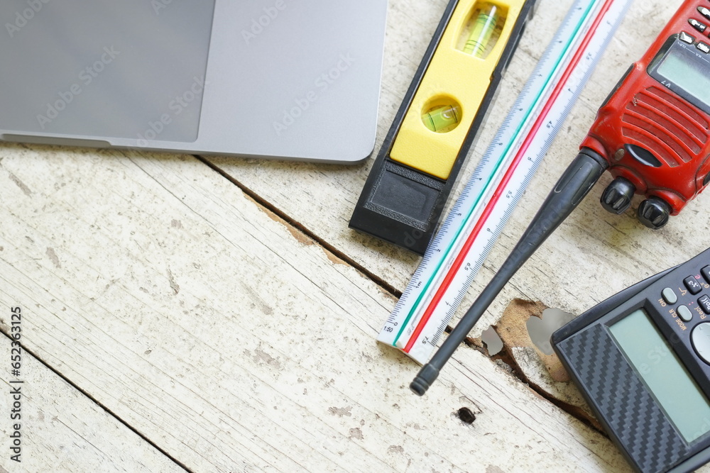 Set of professional construction tools and safety helmet on a work ...