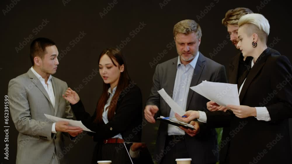 Successful five business people analyzing stocks indoors. Strategy ... Successful five business people analyzing stocks indoors. Strategy ...