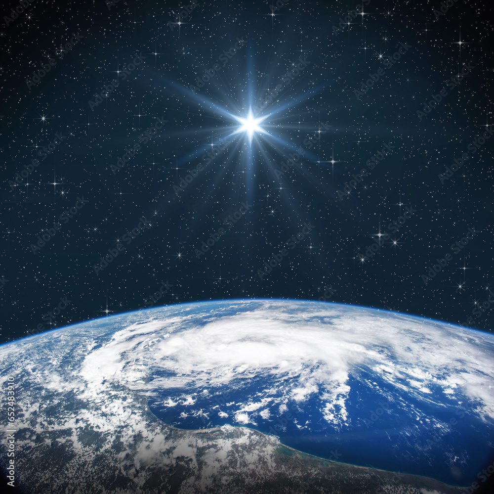 Bright star shines above the Earth in starry space. Birth of Jesus ...