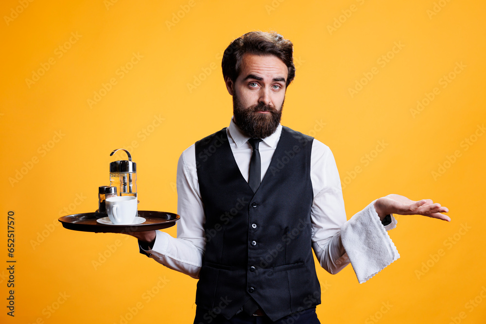 Male waiter feeling unsure in studio, doing i dont know gesture and ...