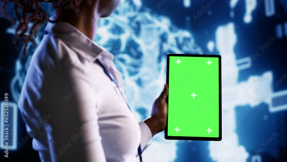 Admin in data center with green screen tablet using artificial intelligence computing simulating ...