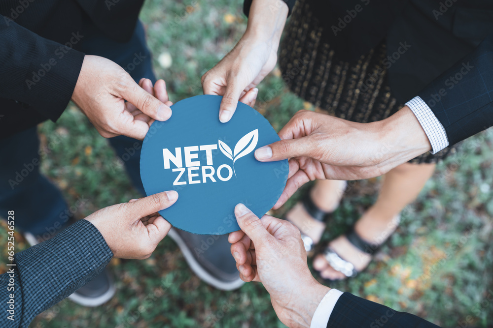 Business people holding ECO friendly idea symbol together as group of ...