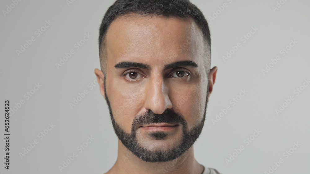 Handsome person look at camera close up. Young adult man face portrait ...