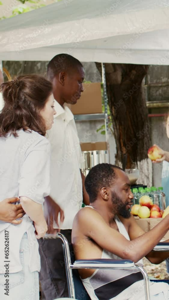 Vertical video Humanitarian aid team providing assistance to the ...