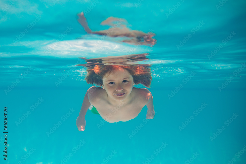 Child in swimming pool underwater. Kid underwater swim. Child splashing ...