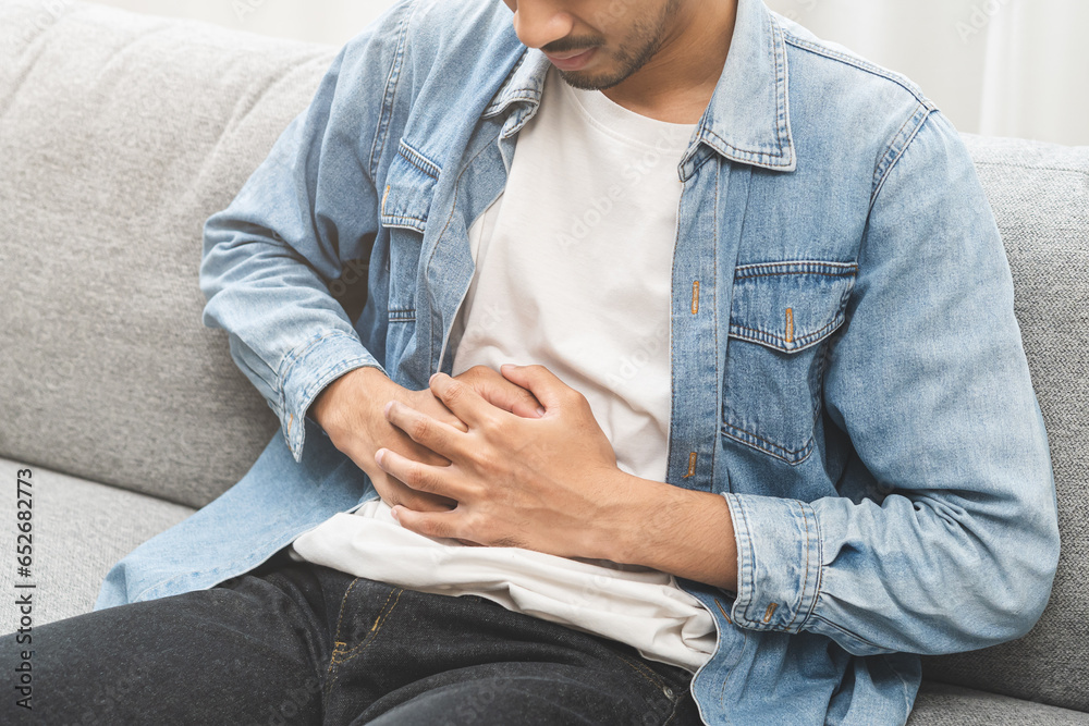 Flatulence ulcer, hurt suffer asian young man, male hand in belly ...