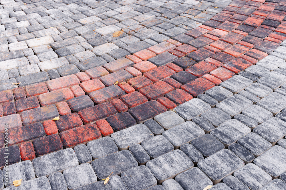 Photo & Art Print Laying paving slabs of various sizes with rounded ...