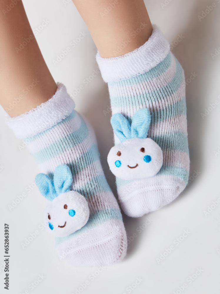 Children wearing pair of socks. Top view to kids foots in mismatched ...