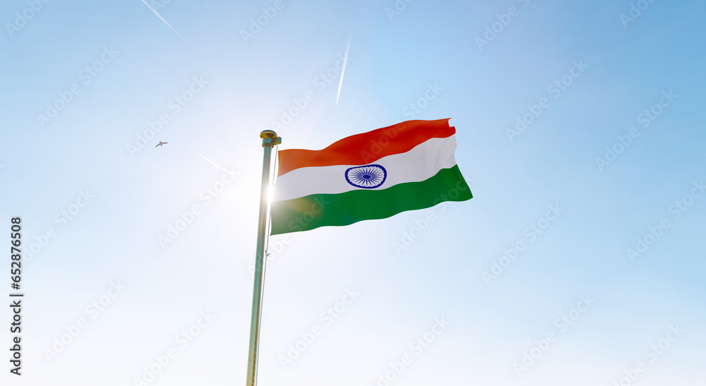 Flag of India flag waving in the wind, sky and sun background. India ...