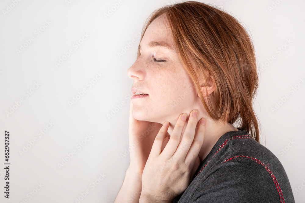 Beauty face. Smiling red haired woman touching healthy skin. Beautiful ...