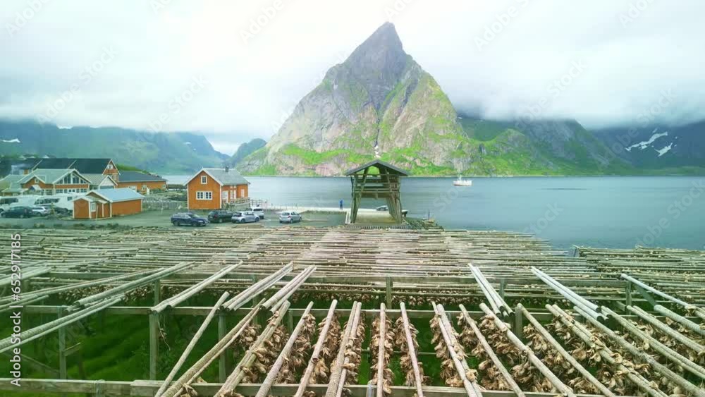 Norwegian traditional fishing boat in harbor. Aerial view of Lofoten ...