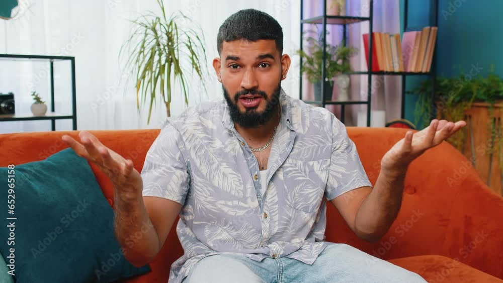 What. Why. Frustrated Indian man raising hands in indignant expression ...