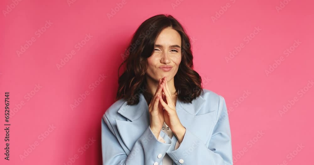 Mysterious sly woman steeple fingers and schemes something tries to ...