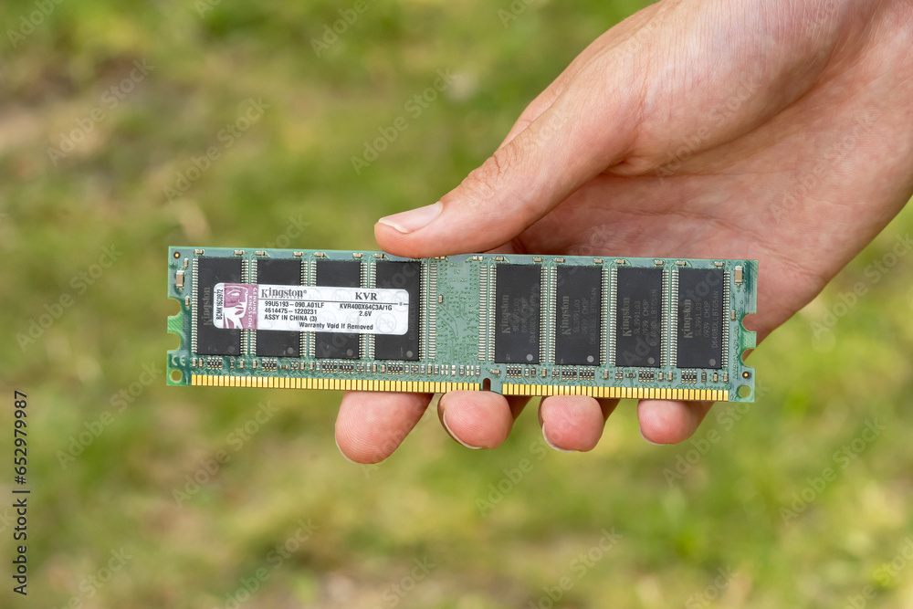 Simple old Kingston RAM stick held in hand, man holding a single small ...