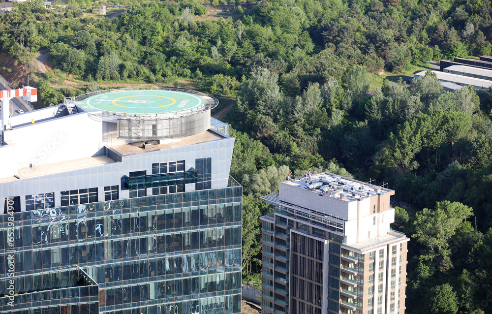 Aerial view of helipad. Helicopter landing pad on rooftop on skyscraper ...