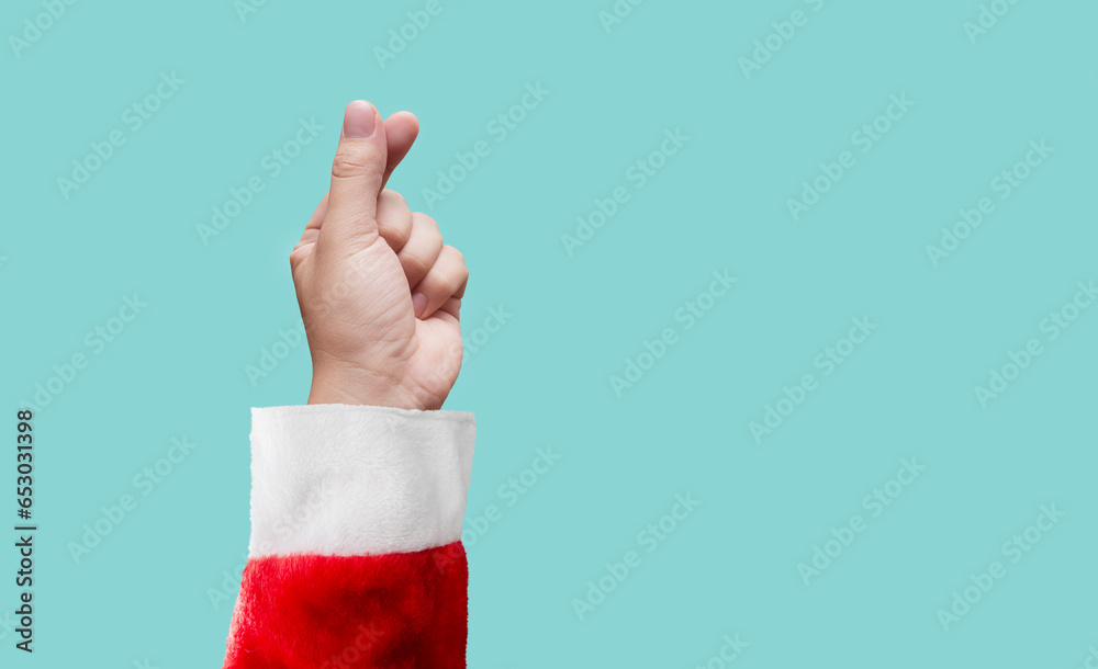 person dressed as Santa Claus forming a modern heart with his fingers ...
