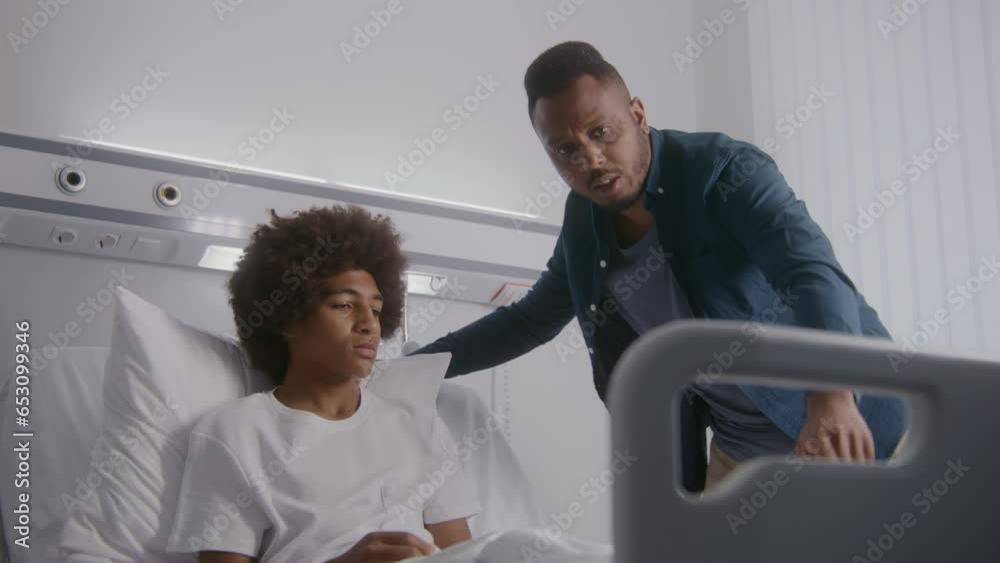 Man visits son in medical center and discusses results of operation ...