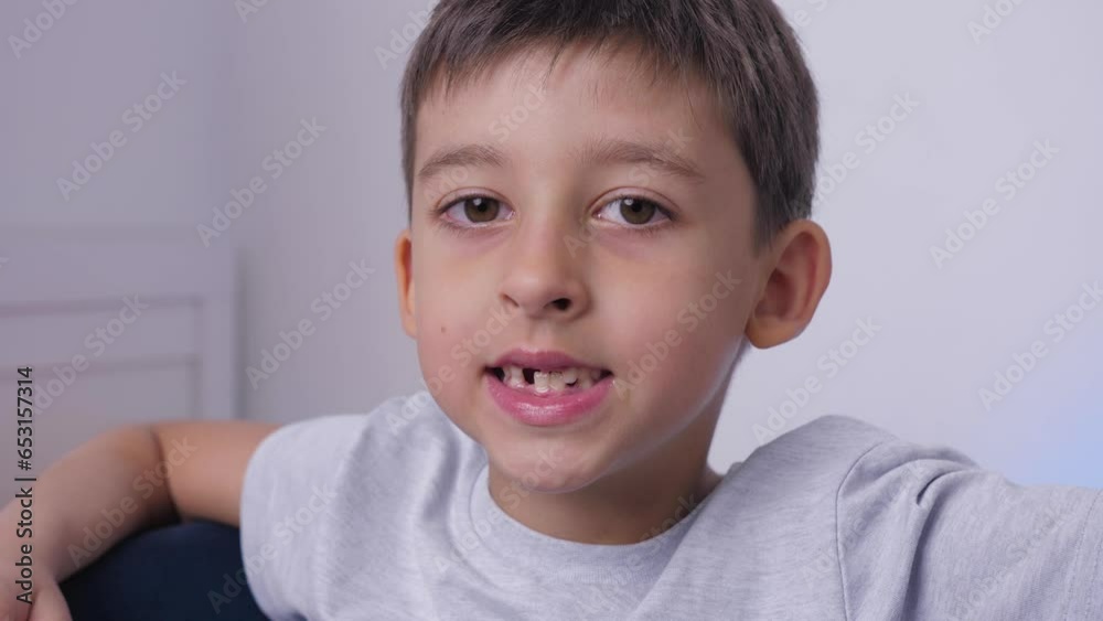 Close-up mouth child has lost one milk teeth. Replacement of permanent ...