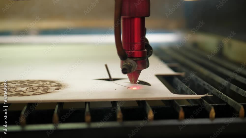 A machine for laser cutting of sheet wood. A modern CNC laser cutting ...