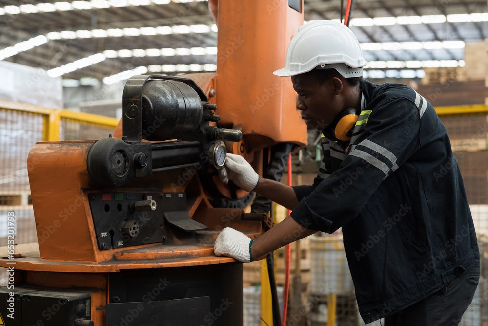 Industrial Robotic Arms. Automated manufacturing industries. Male ...
