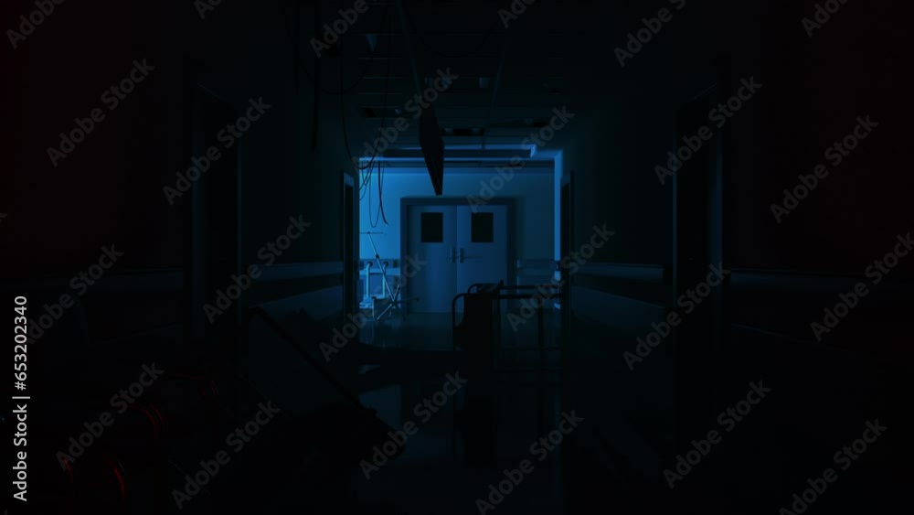 Dark, scary corridor with overturned beds and objects from the ...
