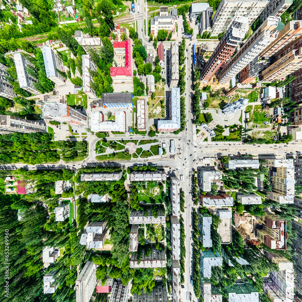 Aerial city view with crossroads and roads, houses, buildings, parks ...