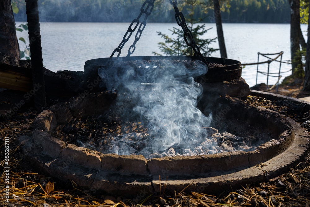 Smoking campfire, fire pit in Lapakisto Nature Reserve in Finland ...