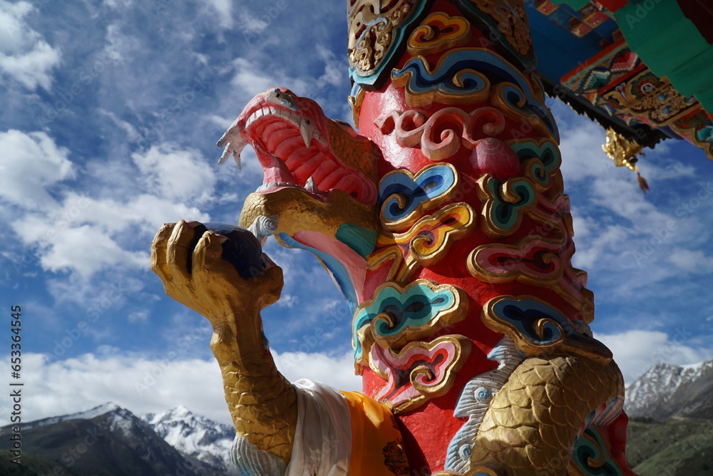 Dragon sculpture and colourful columns of a remote temple as signs of a ...