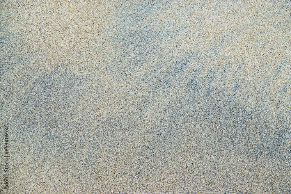 Beach sand washed smooth by the waves of the sea. Sandy beach detail ...