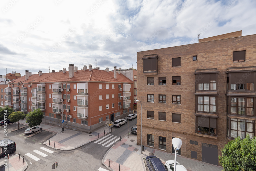 Facades of a residential building at a street intersection with painted ...