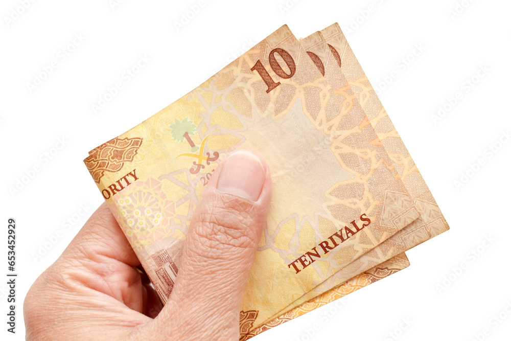 10 Riyal Saudi Arabia money banknotes in hand isolated on white ...