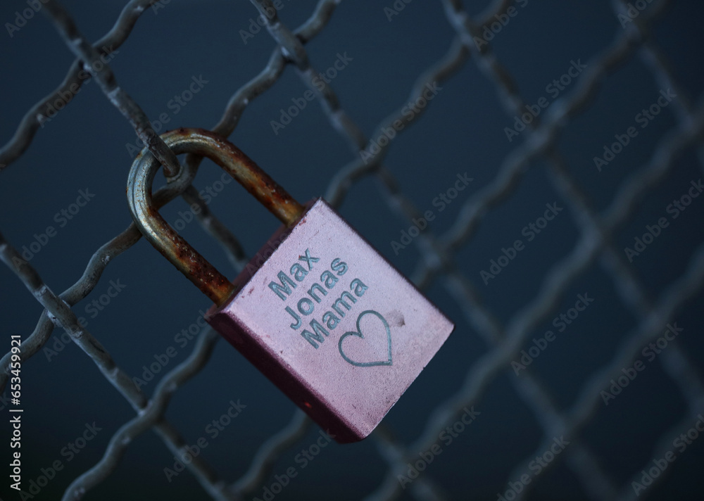 Old and new locks with names and dates written on them couples ...