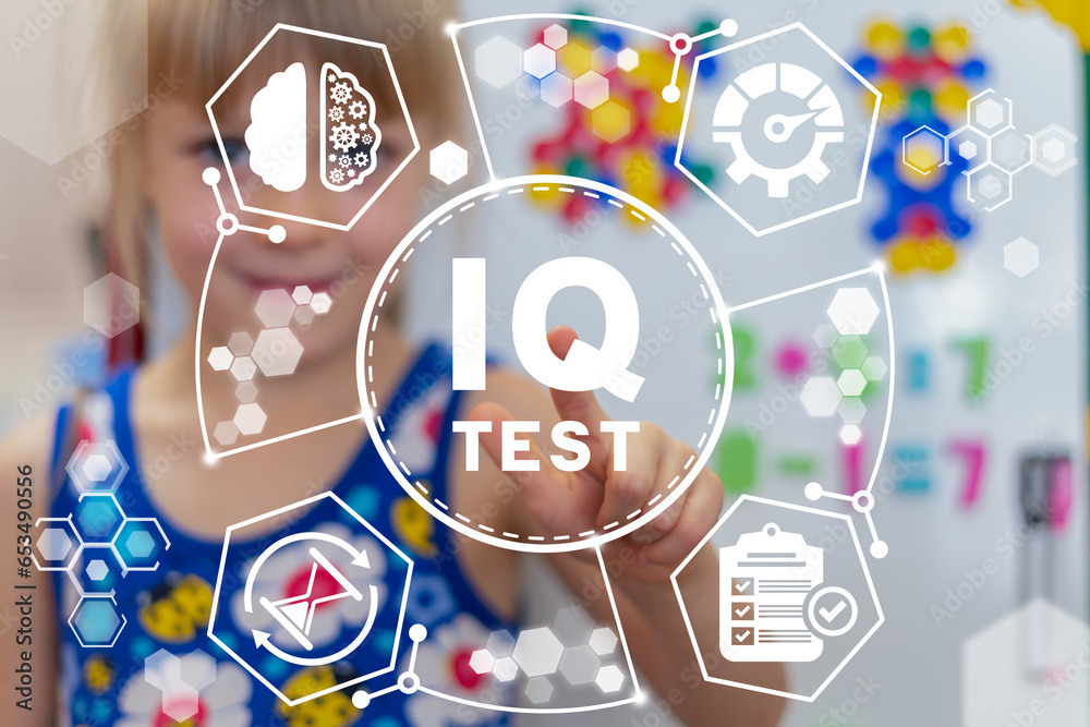 Little girl using virtual touch interface presses inscription: IQ TEST ...