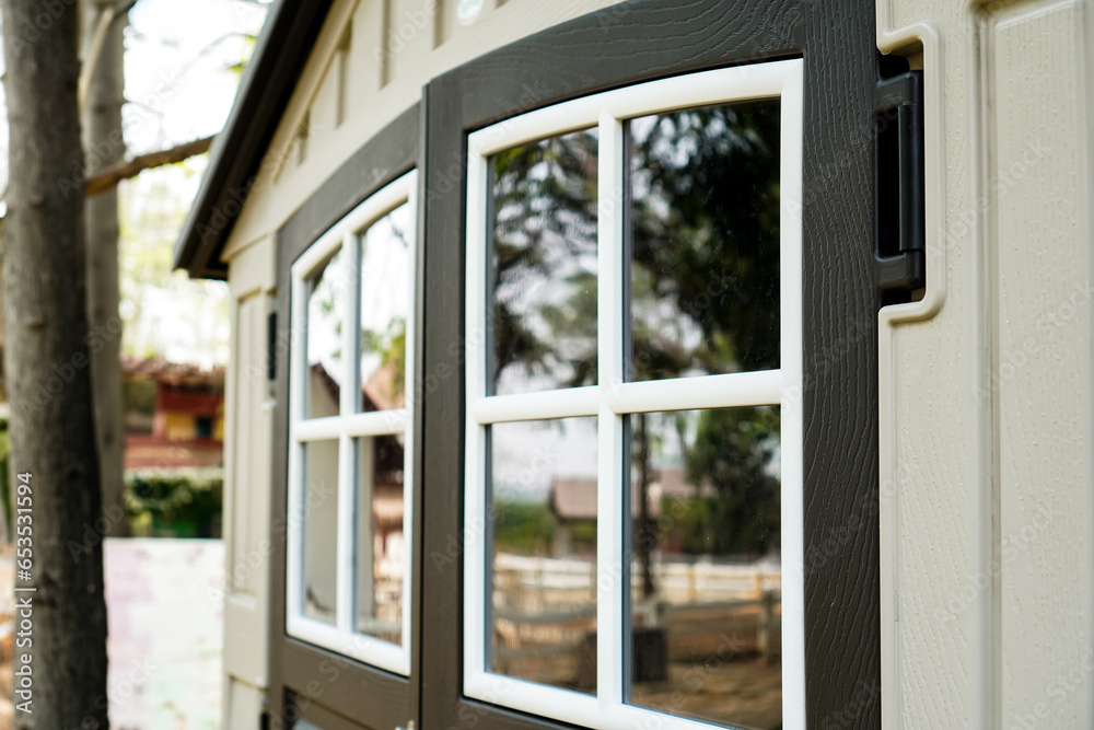 A side view close-up picture showing a small one-story prefab house ...
