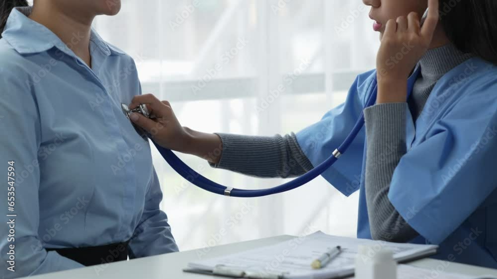 The doctor examines the patient's heart to analyze and listen to ...