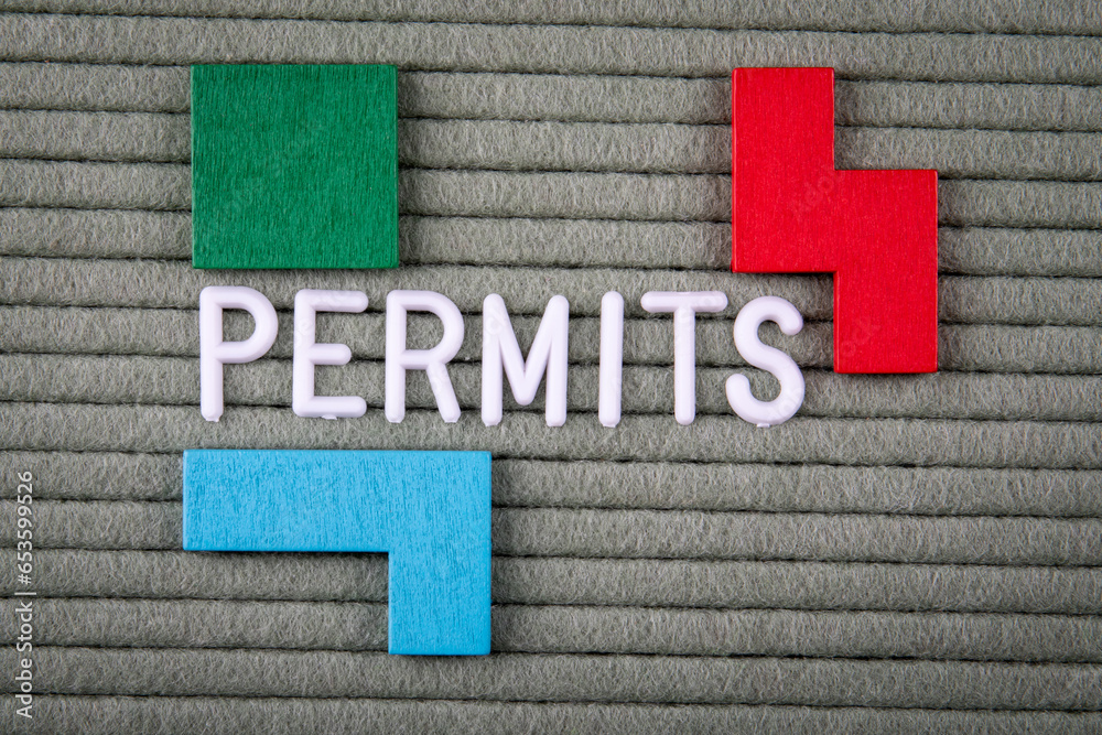 Permits Concept. White letters of the alphabet on a green background ...