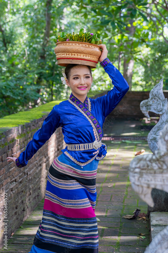 Burmese girl in the temple, a Burmese woman wearing the Traditional ...