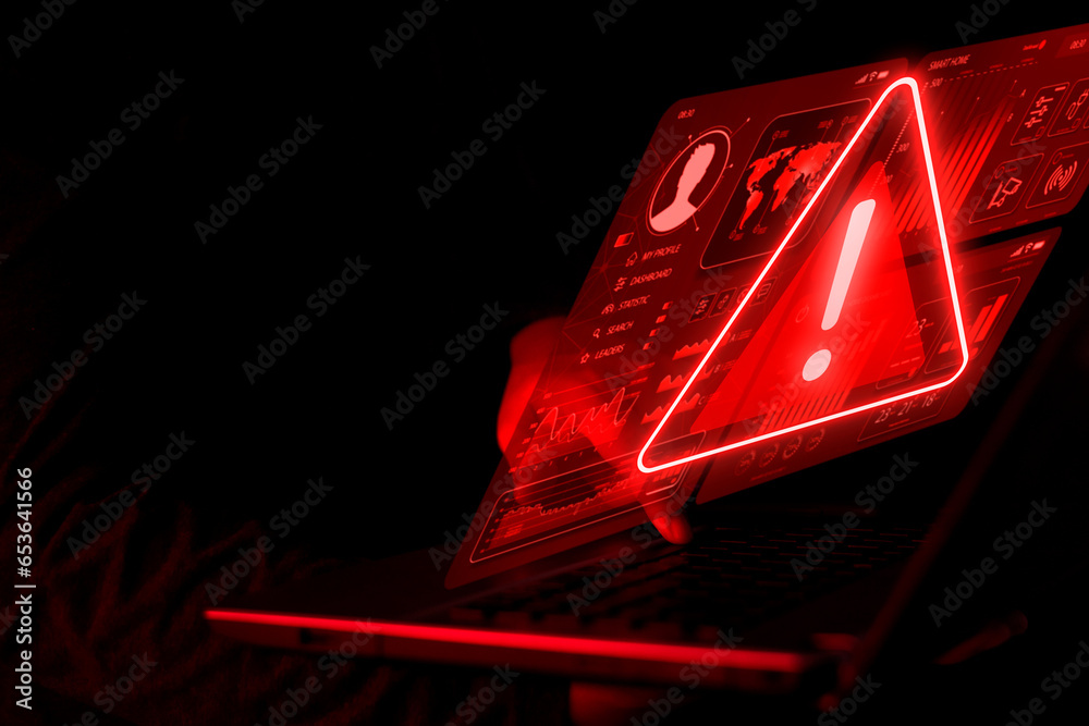 A hand is touching the screen to warn of an abnormality due to a hacker ...