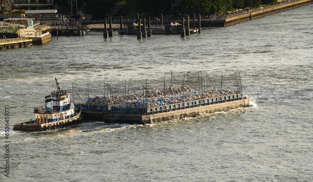 Cargo ship transporting plastic garbage to be recycled. Trash ...