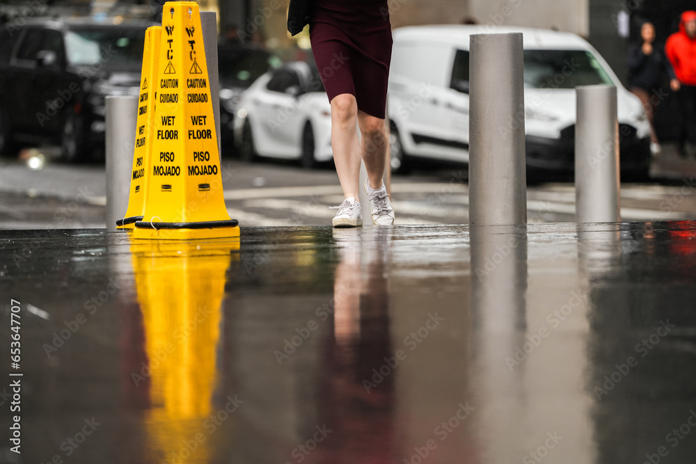 Wet floor. Yellow warning indicator with Wet floor message written in ...