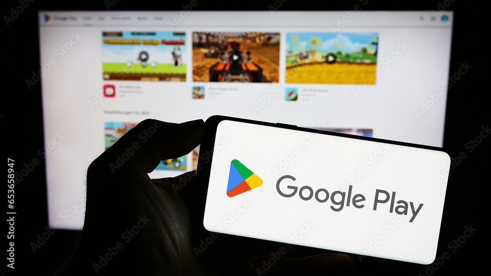 Foto de Stuttgart, Germany - 09-23-2023: Person holding cellphone with logo of app distribution ...