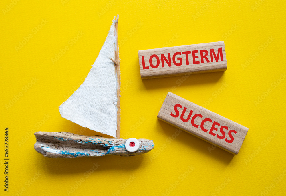 Longterm success symbol. Wooden blocks with words Longterm success ...