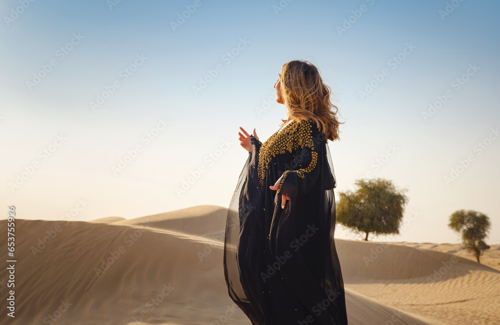 Desert adventure. Young arabian Woman posing in traditional Emirati ...