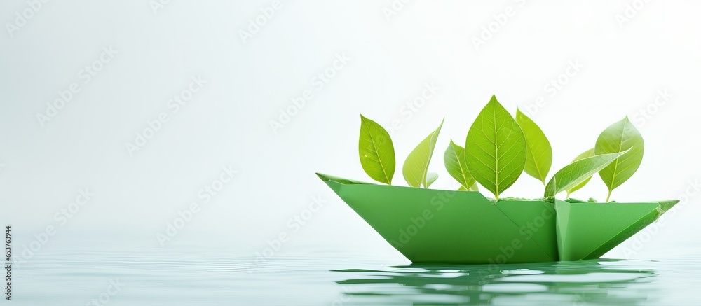 Eco friendly maritime transport concept Leafy paper boat represents ...