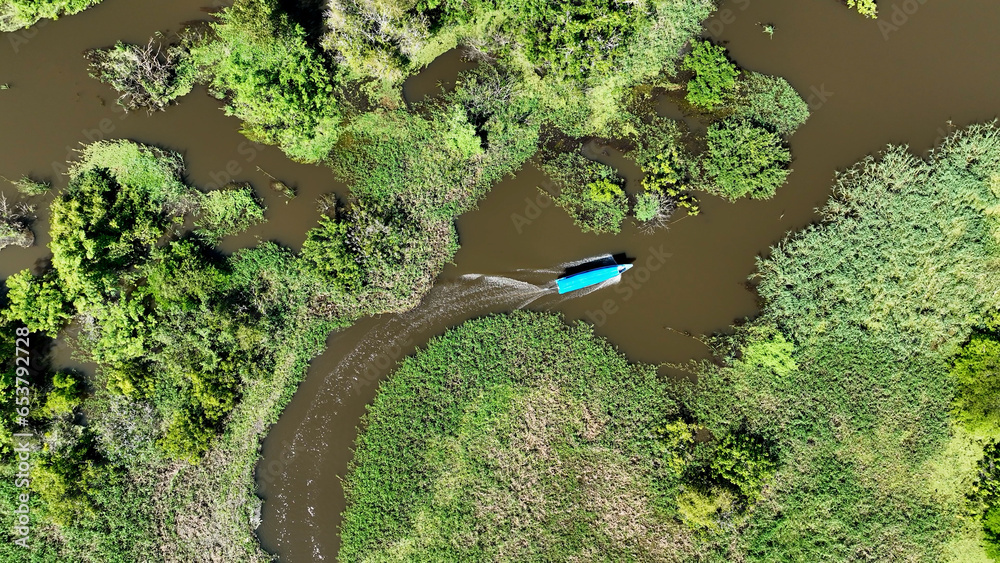 Boat sailing at Amazon river at Amazon forest at Amazonas state Brazil ...